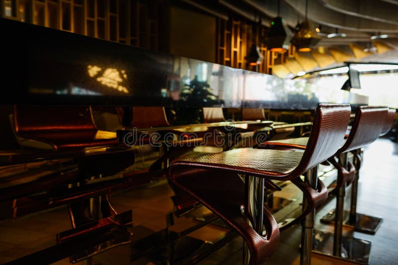 Modern Bar Stools in Front of Counter Stock Photo - Image of bistro ...