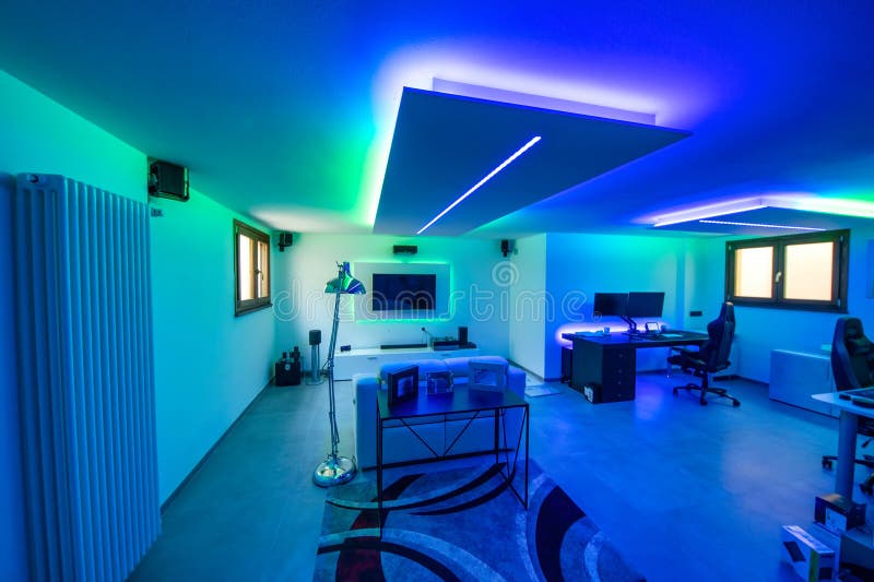 A Modern Basement Room Illuminated by Colorful Led Lights Stock Photo ...