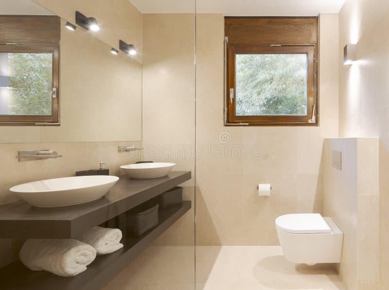 Modern Bathroom Front View with Large Light Marble Slabs. There are Two ...