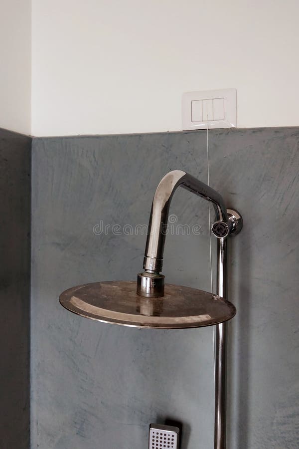 Modern Bathroom Showerhead with Grey Tiled Wall and Switch Panel Stock ...