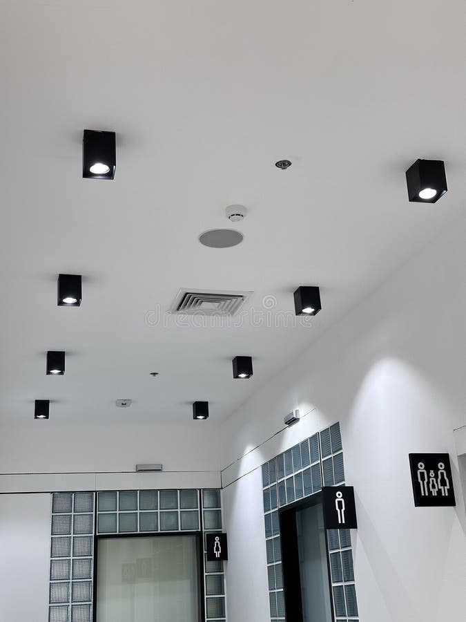Modern Bathroom Sign Hanging on the Ceiling in a Shopping Mall Stock ...