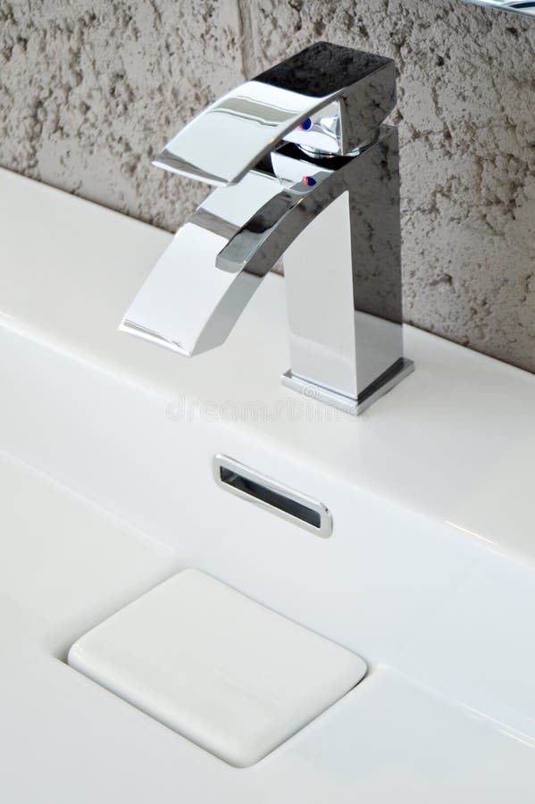 Modern bathroom taps stock image. Image of home, hand - 61295835