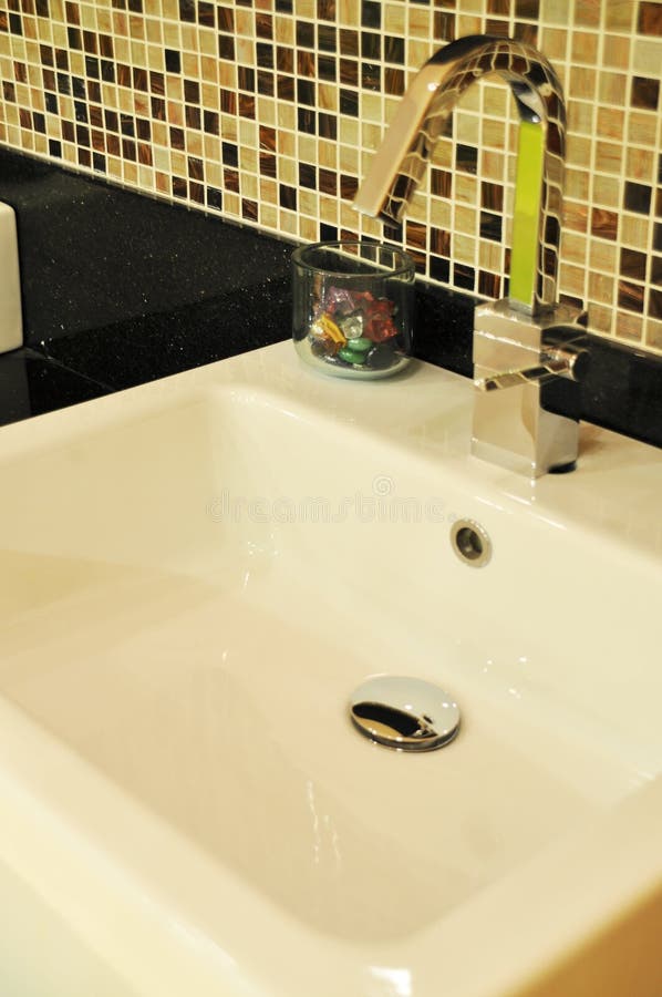 Modern bathroom taps stock image. Image of designer, faucet - 68903607