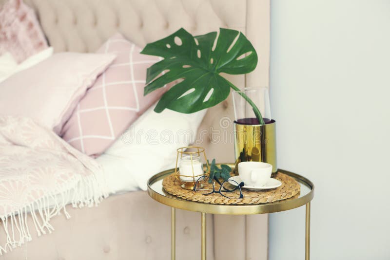 Bedroom with Table Side and Pillows on the Bed Stock Photo - Image of ...