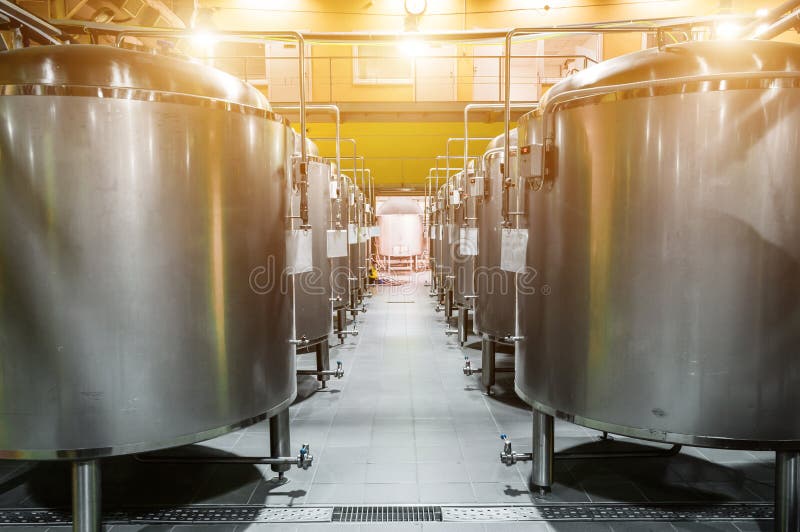 Modern Beer Factory. Rows of Steel Tanks for the Storage Beer. Stock ...