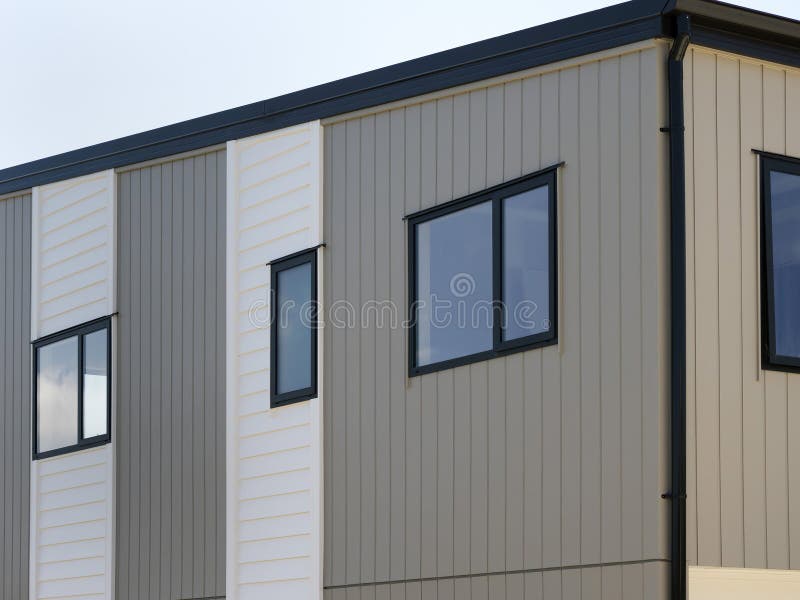 Modern Beige and White Building Facade Black Framed Windows Stock Photo ...