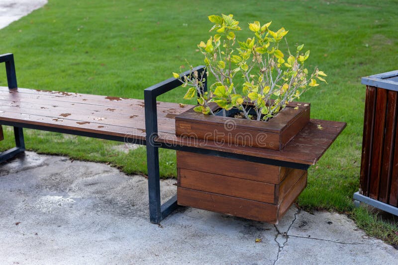 Modern Bench with Integrated Planters in a Park Setting Surrounded by ...