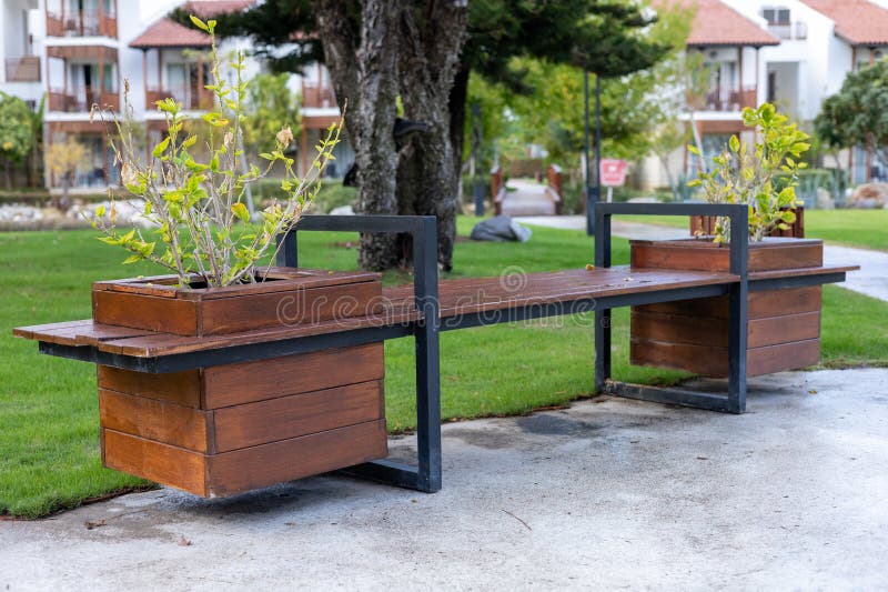 Modern Bench with Integrated Planters in a Park Setting Surrounded by ...