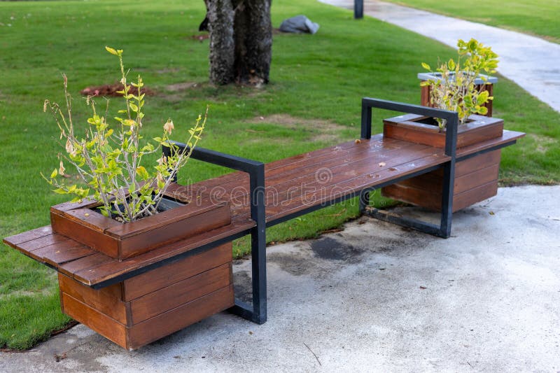 Modern Bench with Integrated Planters in a Park Setting Surrounded by ...