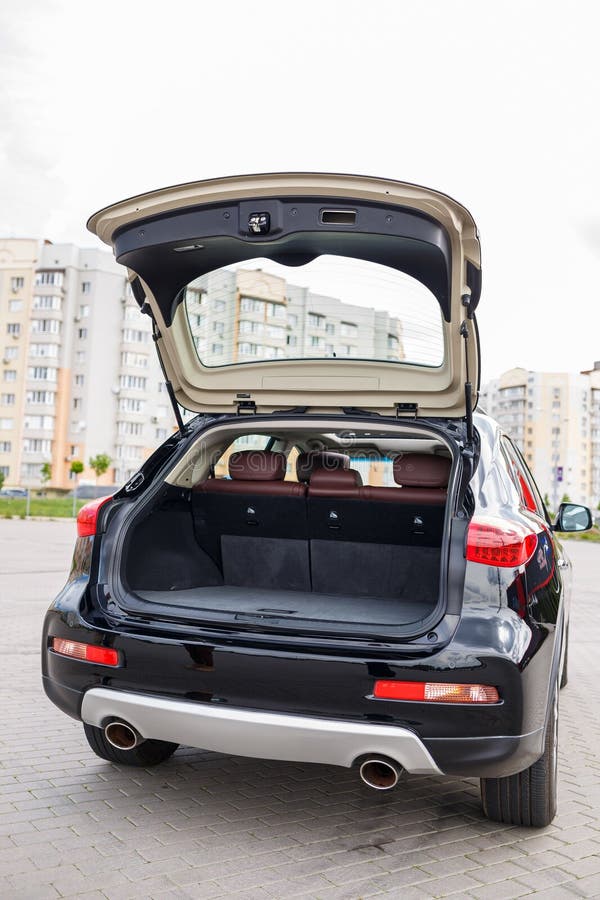 Modern Black Car, Black SUV Jeep on Big Wheels. Rear View of Open Car ...