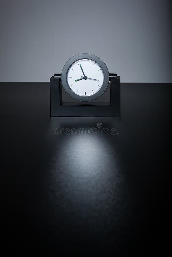 Modern Black Clock on Black Table in the Office Stock Photo - Image of ... Modern Black Clock on Black Table in the Office Stock Photo - Image of ...
