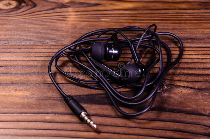 Black Earphones on Wooden Table Stock Image - Image of audio, music ...