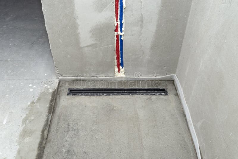 A Modern Black Linear Shower Drain Installed in the Shower Floor ...