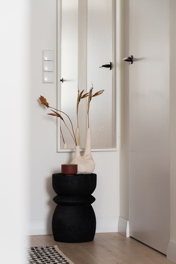 Black Side Table with Decorations in Corridor Stock Photo - Image of ...