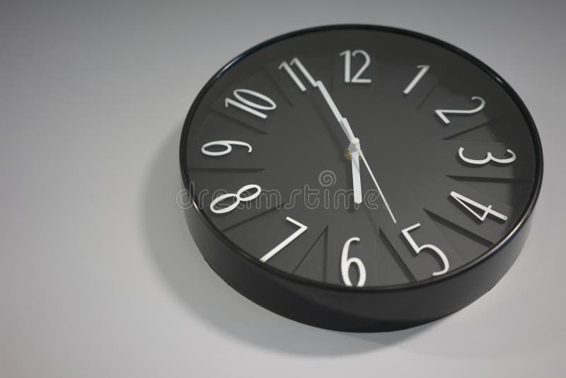 Modern black wall clock stock image. Image of clock - 358669175