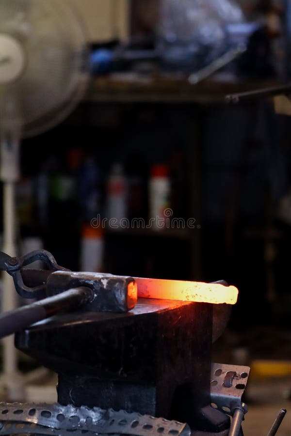 Modern Blacksmith Working in His Shop Stock Photo - Image of grinding ...
