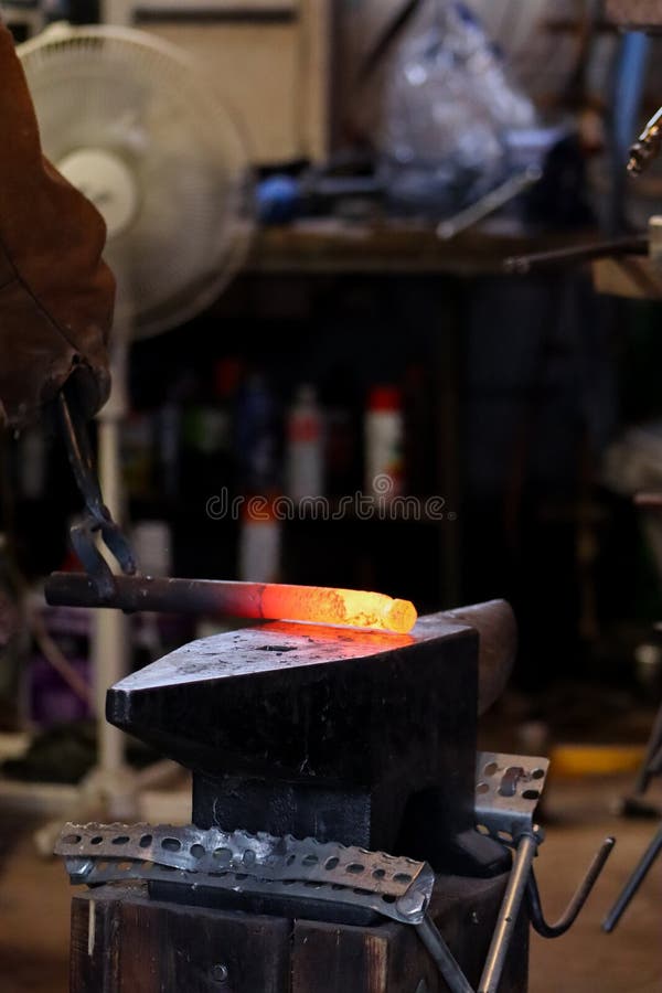Modern Blacksmith Working in His Shop Stock Image - Image of hand, shop ...