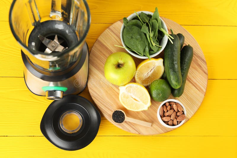 Modern Blender with Ingredients for Smoothie on Yellow Wooden Table ...