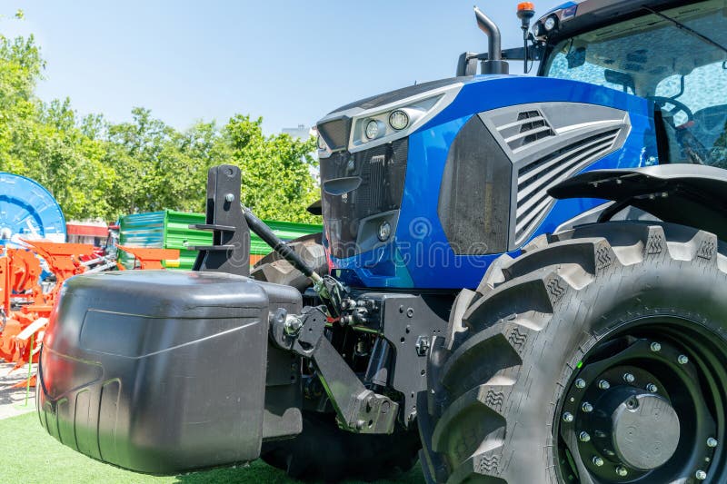 Modern Blue Agricultural Tractor on a Field. Stock Image - Image of ...