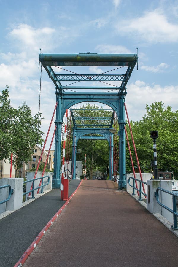 Modern Blue Bridge in Amsterdam Under the Sky Stock Photo - Image of ...