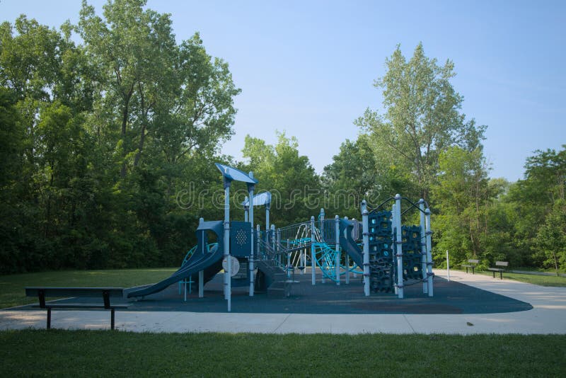 Modern Blue Playground in a Lush Green Park Setting Stock Image - Image ...