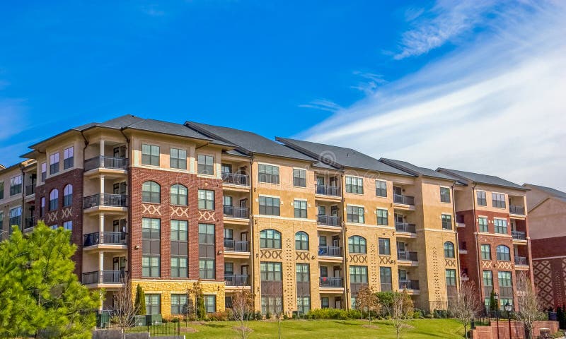 Brick Apartments and Clouds Stock Photo - Image of blue, brick: 122379052