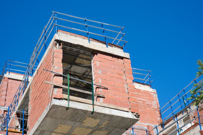 Modern Brick Building Construction Against Clear Blue Sky in Urban ...