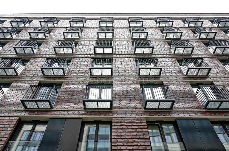 A Modern Building Facade Featuring a Pattern of Windows and Balconies ...