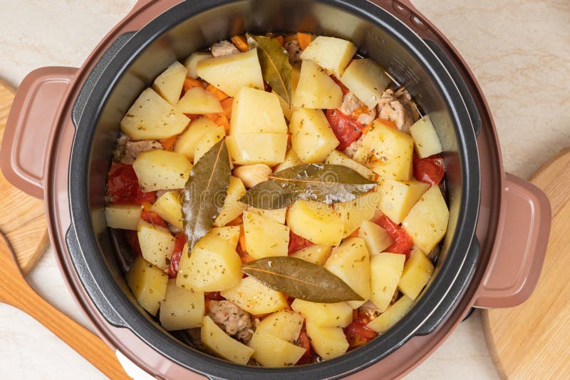 Modern, Bright Light Multi Cooker with Just Cooked Stewed Potatoes with ...