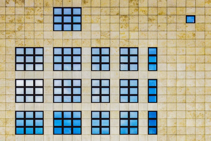 Modern Brown Building with Blue Glass Windows and Rusty Aesthetics ...