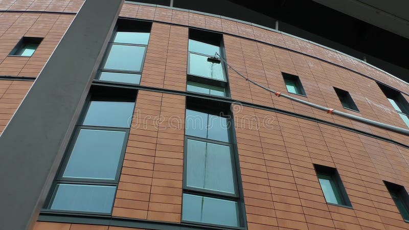 Modern Building Cleaning with Water Fed Pole System Stock Video - Video ...