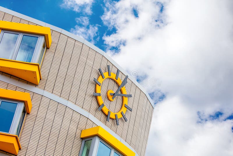 Modern building with clock stock photo. Image of angled - 174020478