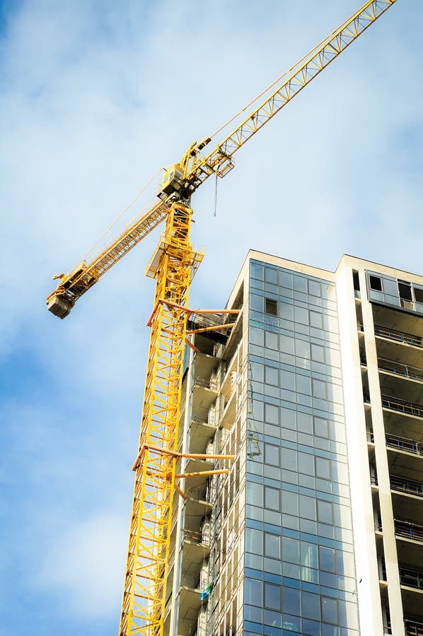 Unfinished Building and a Lifting Crane Stock Photo - Image of lifting ...