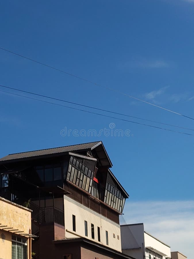 Modern Building with Creative Design Under a Clear Sky Stock Photo ...