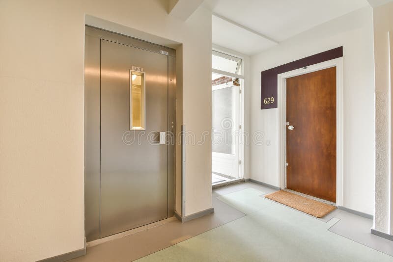 Modern Building Entrance with Elevator Stock Photo - Image of lessthan ...