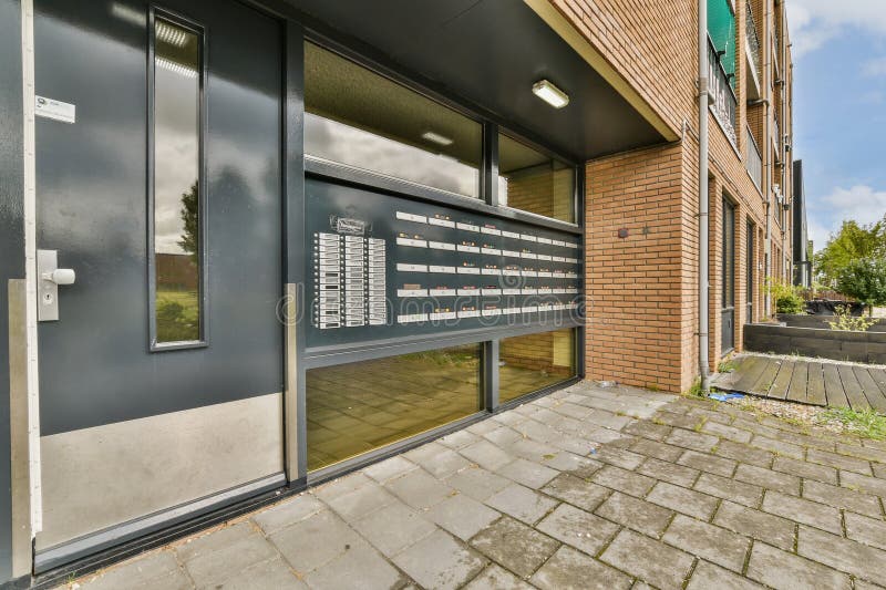 Modern Building Entrance with Mailboxes Stock Image - Image of facility ...