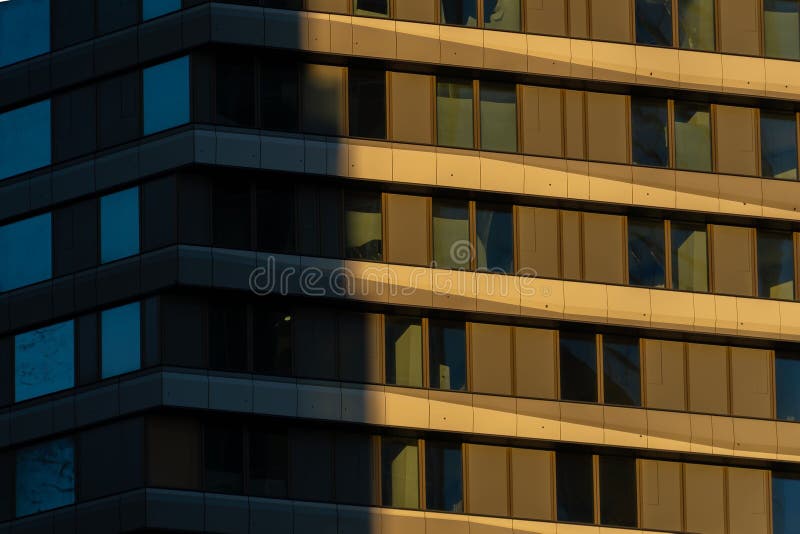 Modern Building Facade with Contrasting Light and Shadow Patterns in an ...