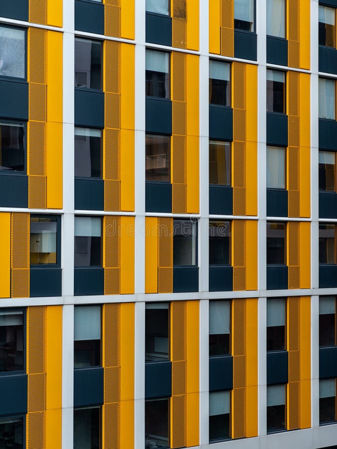Modern Building Facade Featuring a Pattern of Yellow and White Panels ...