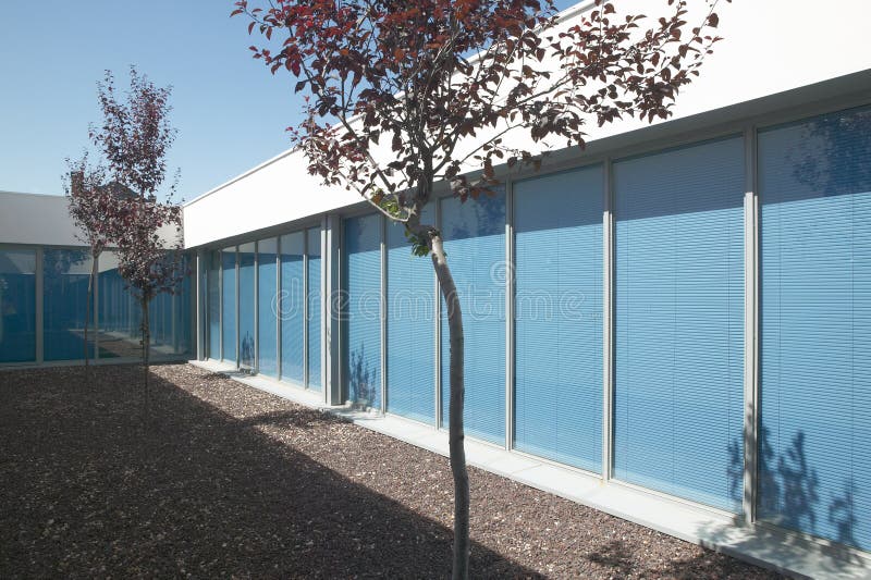 Modern Building Facade with Trees. Stock Photo - Image of blind, metal ...