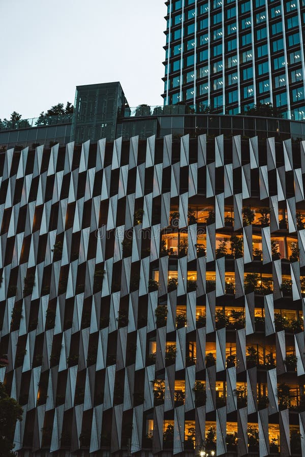 Modern Building Facade with Unique Geometric Patterns and Illuminated ...