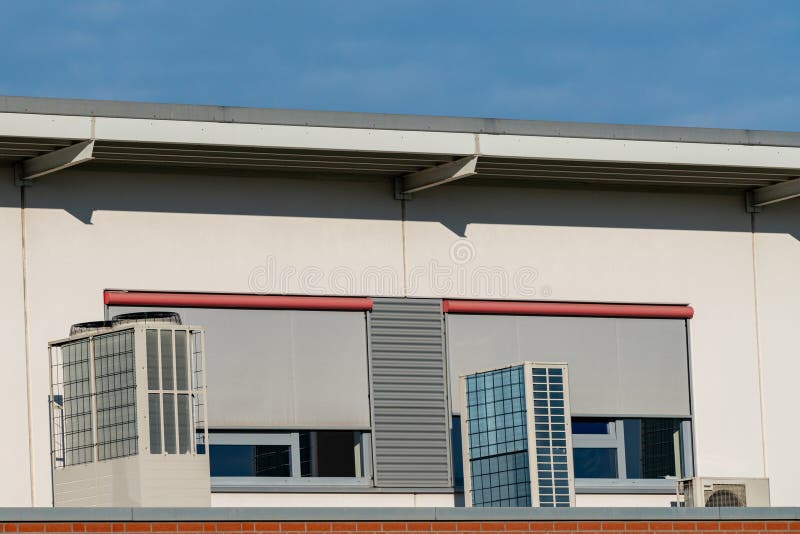 Modern Building Facade with Window Shades and Ventilation Units Stock ...