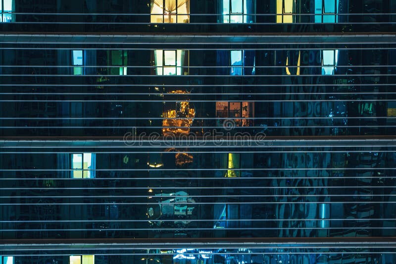 Modern Building Glass Wall with Windows Surface at Night. Illuminated ...