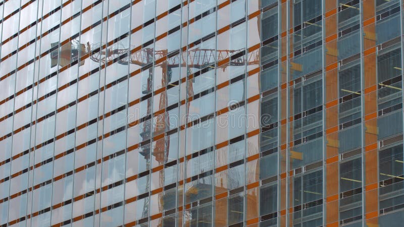 Modern Building with Glass Windows Reflected Sky and Construction Crane ...