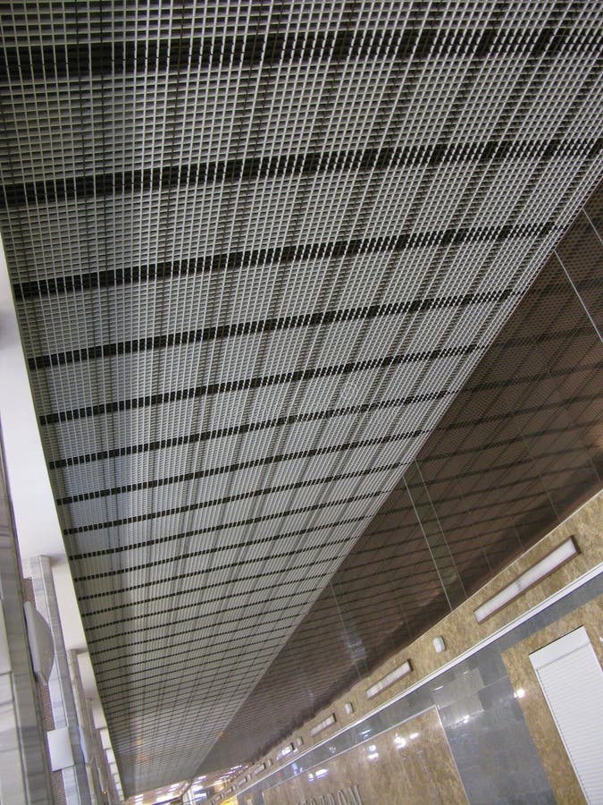 Modern Building Interior with Grid Patterned Ceiling and Sleek Marble ...