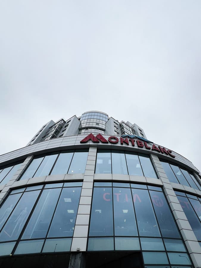Modern Building Montblanc with Reflective Glass Facade Under a Cloudy ...