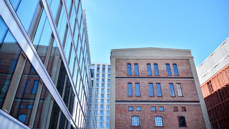 Revitalized Red Brick Building and Modern Office Building. Stock Photo ...