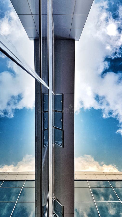 Modern Building with Open Windows Reflecting Clouds in Beautiful Day ...