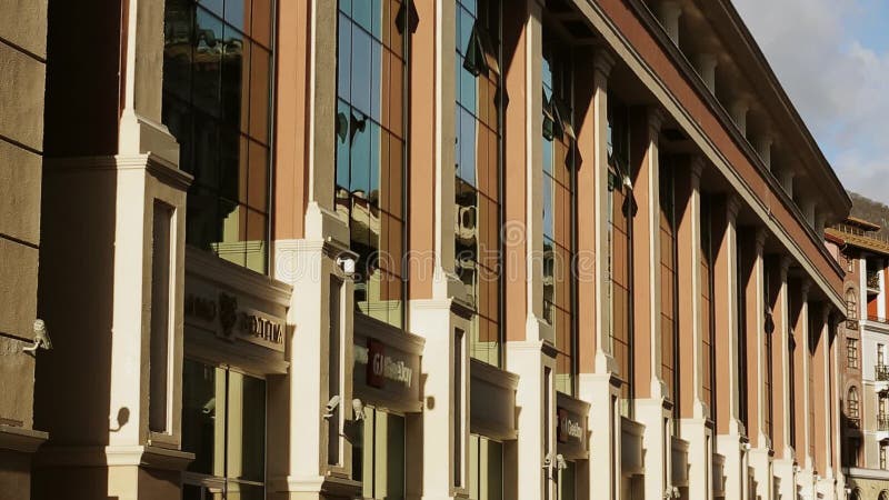 Modern Building with Panoramic Windows on Street. Sunny Evening ...