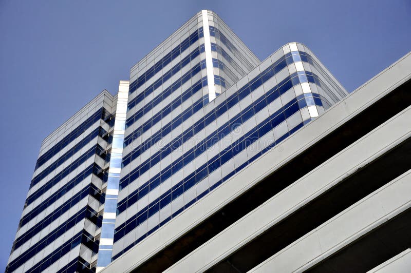 Modern Building Soaring into Blue Sky Stock Photo - Image of office ...