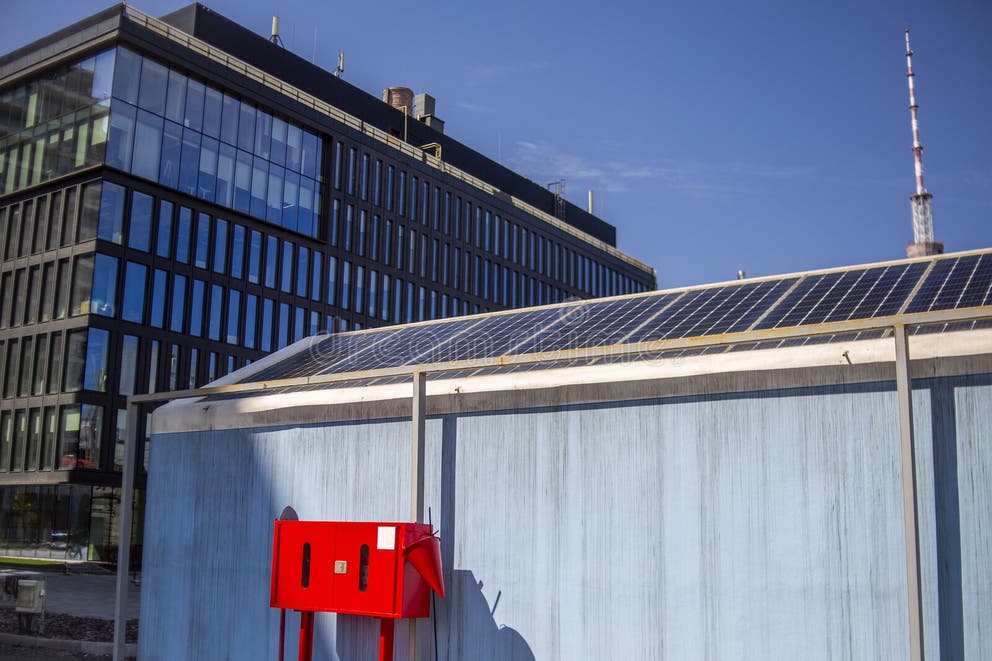 Modern Building with Solar Panels and a Fire Box Under a Blue Sky Stock ...